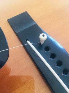 How to change strings on an acoustic guitar with pins (steel) - JG ...