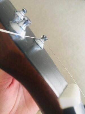 How to change strings on an acoustic guitar with pins (steel) - JG ...