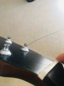 How to change strings on an acoustic guitar with pins (steel) - JG ...